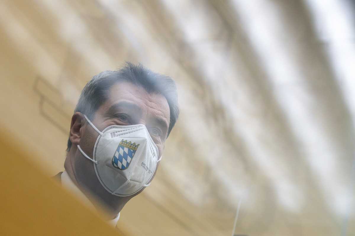 German states tighten virus rules as pandemic battle falters - MarketBeat