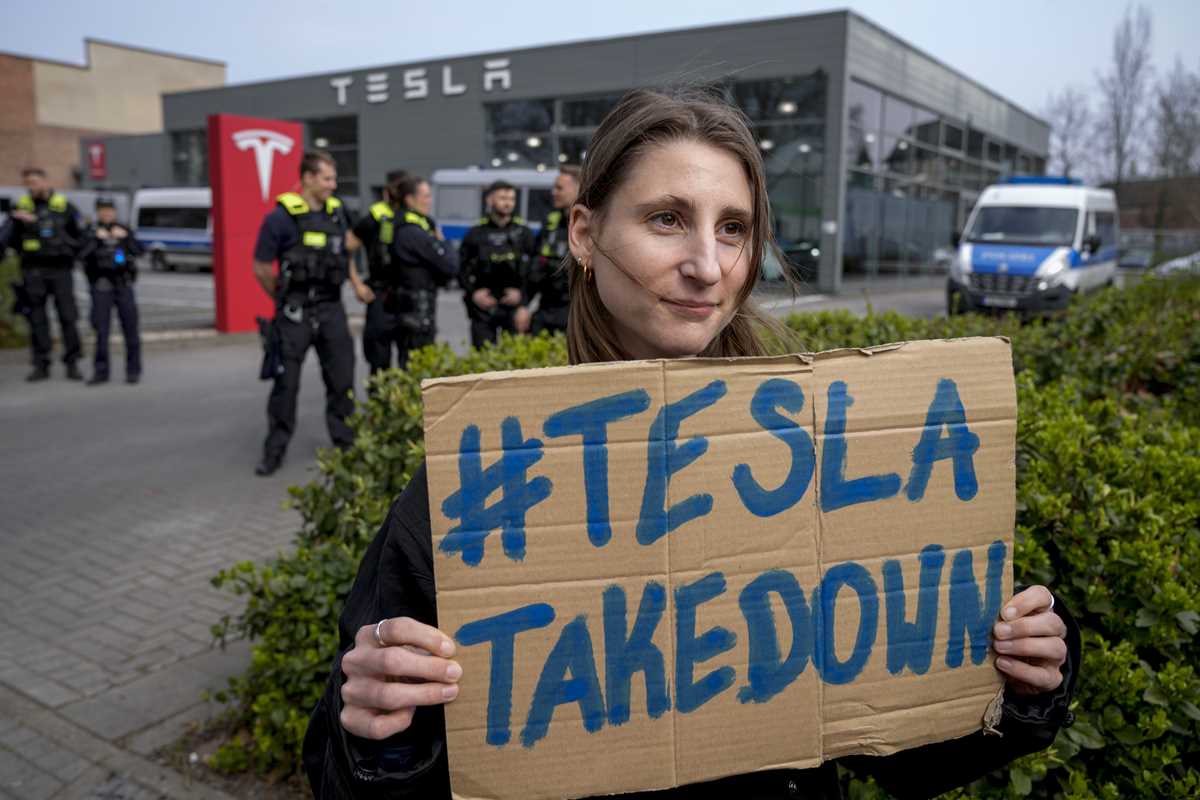 Protests against Elon Musk's purge of US government swarm Tesla showrooms