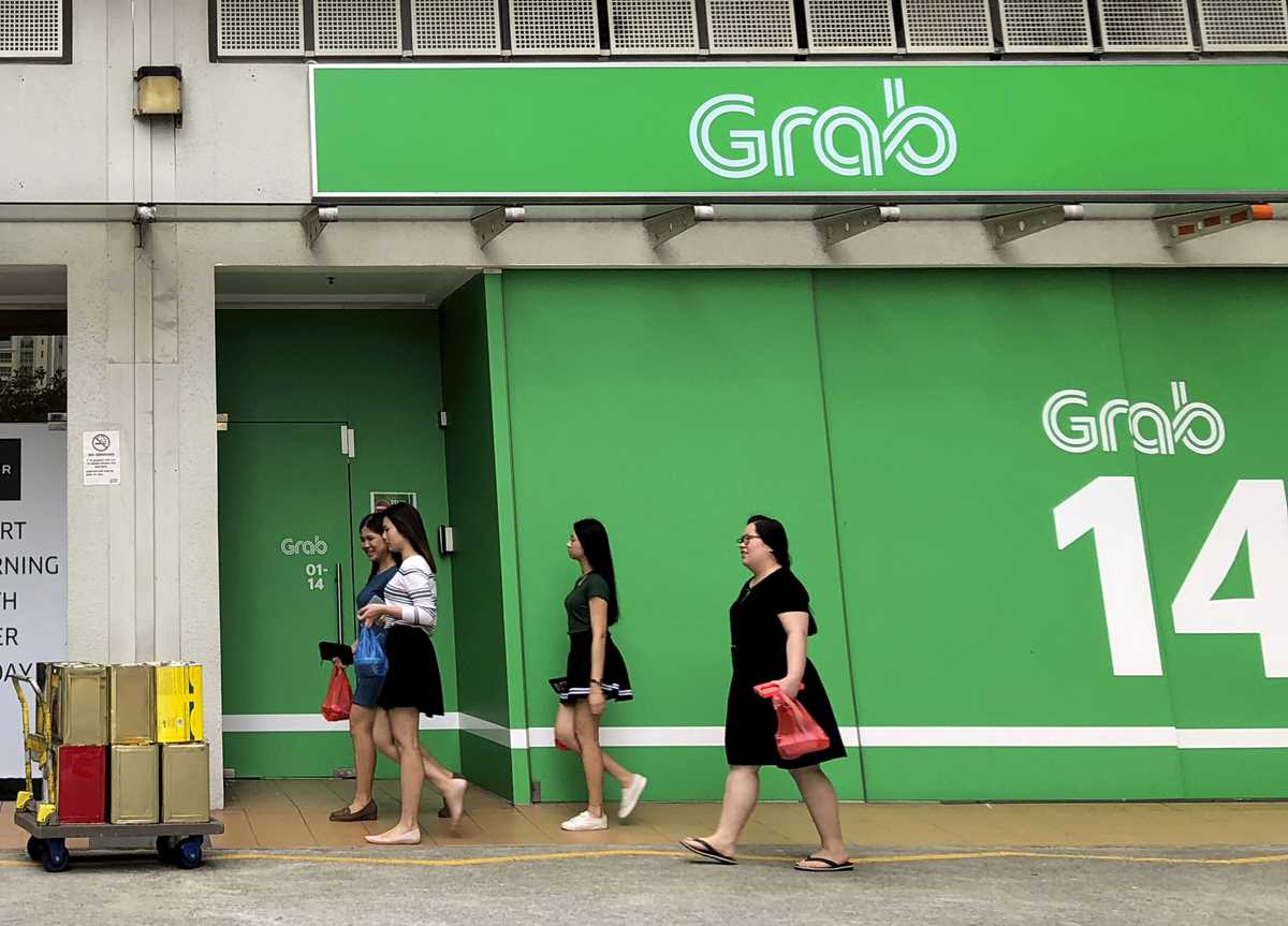 Grab goes public in $40B SPAC deal, slides in market debut
